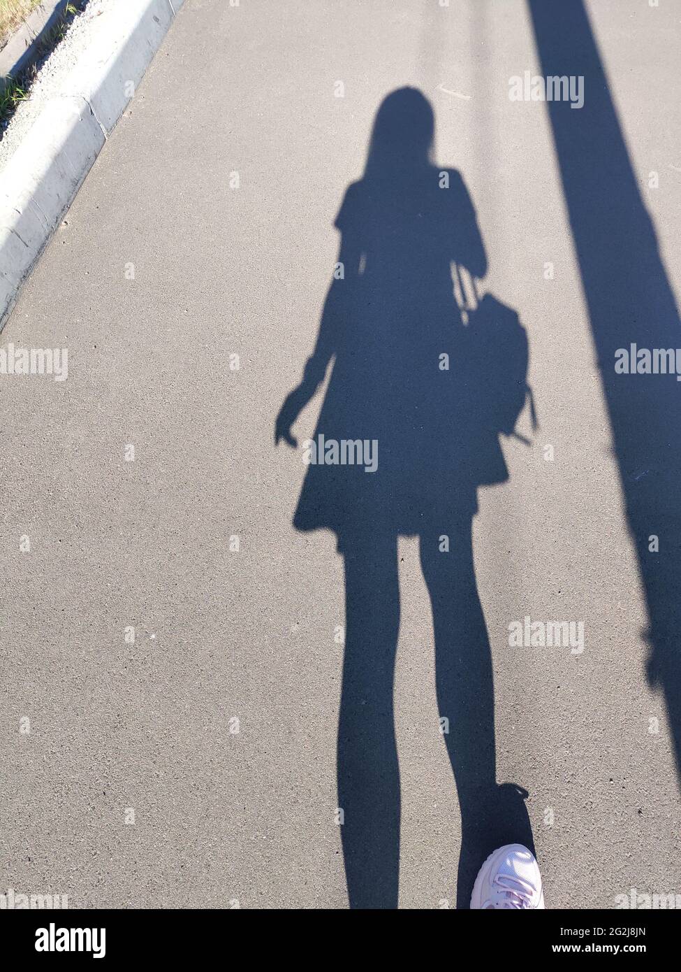 Shadow of the woman in dress on the street Stock Photo - Alamy