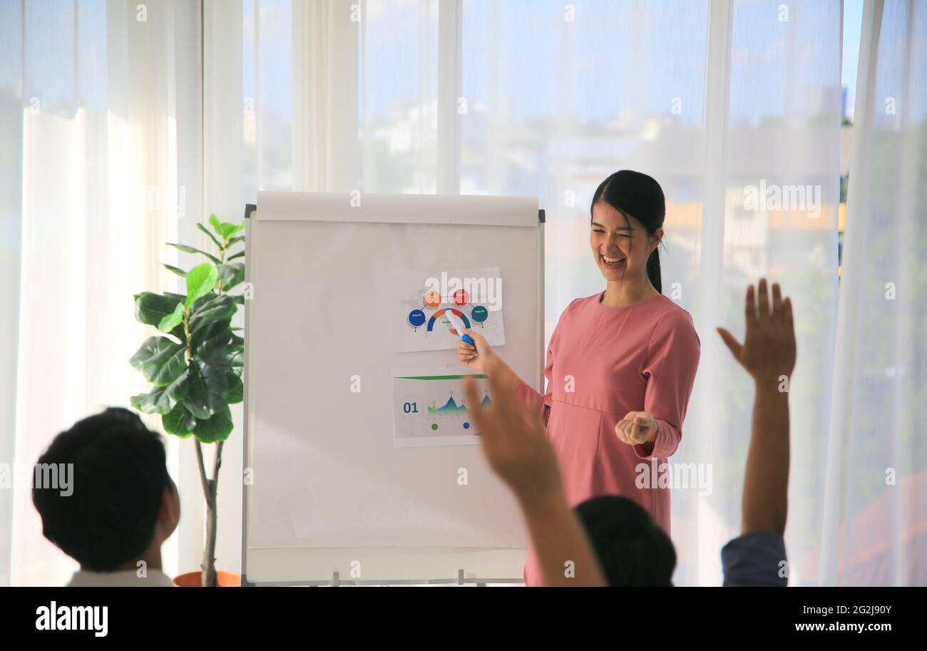 Smiling millennial female coach or presenter talk interact with ...