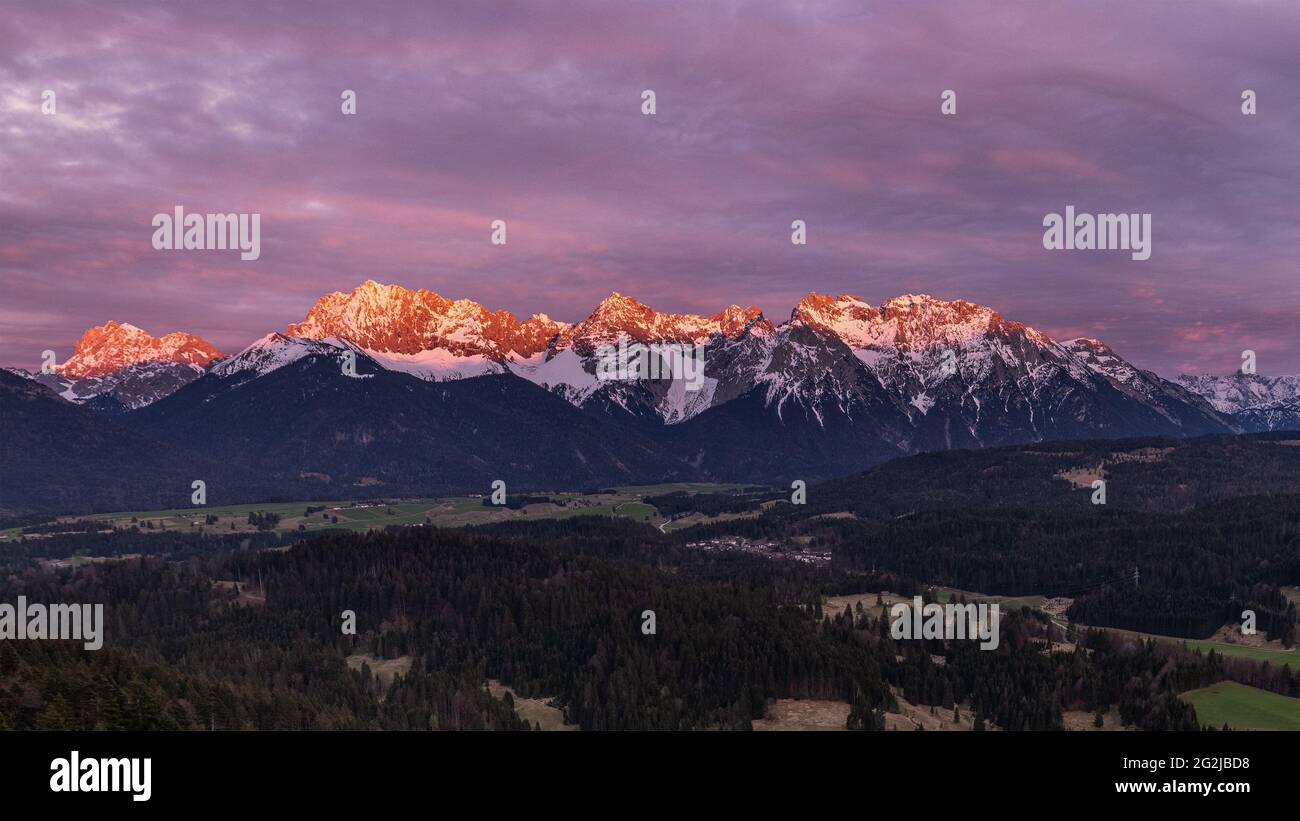 Alpenglow on the snow-covered Karwendel Mountains Stock Photo - Alamy