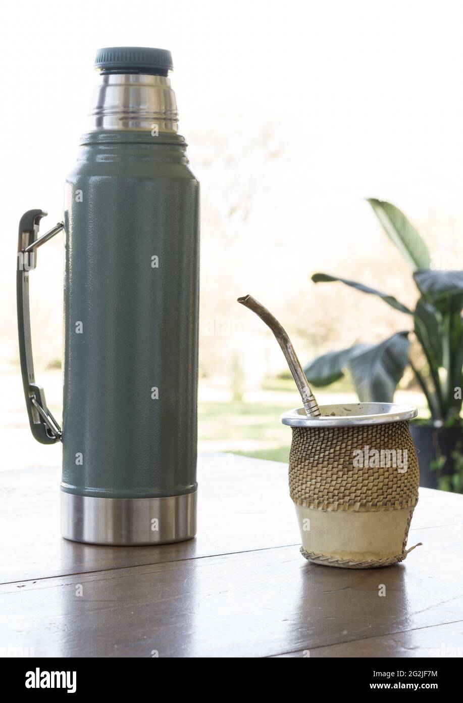 Mate caffeine-rich infused drink in a wood cup put on a wooden table ...