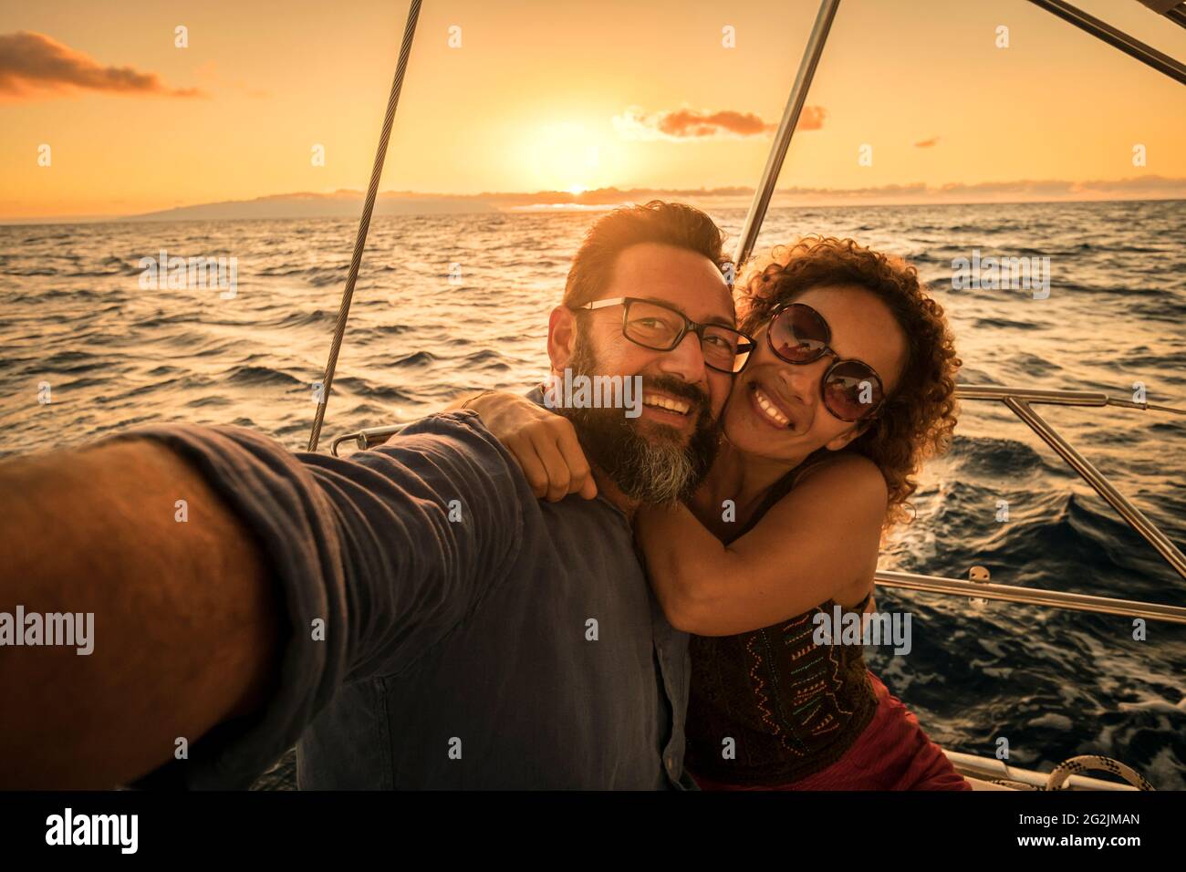 Happy couple of tourist take selfie and smile enjoying the summer ...