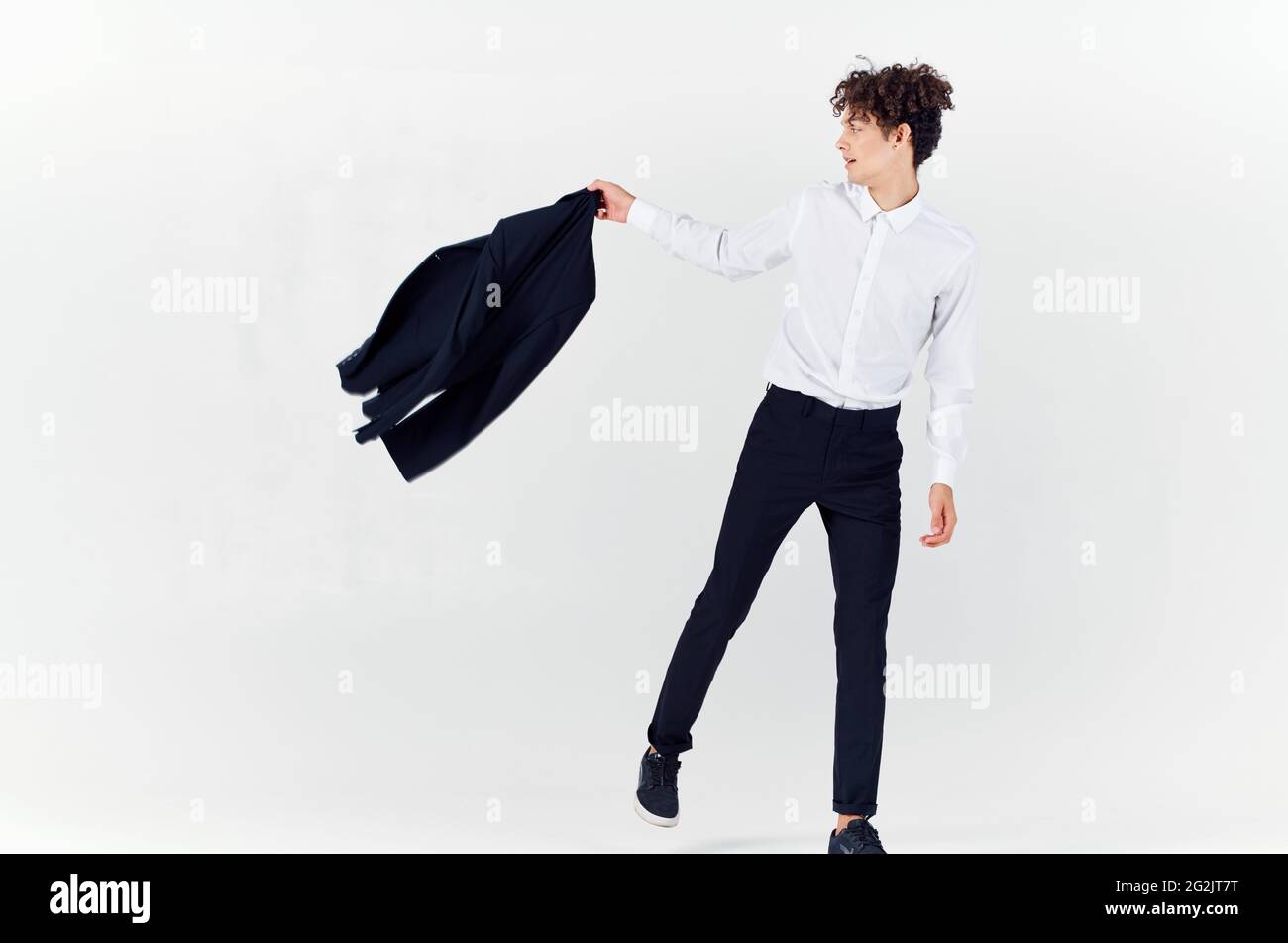 man in suit jacket holding fashion full length posing Stock Photo - Alamy