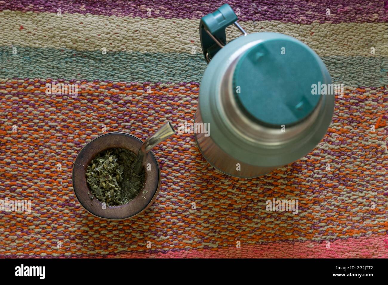 Top view of Mate caffeine-rich infused drink in a palo santo wood cup ...