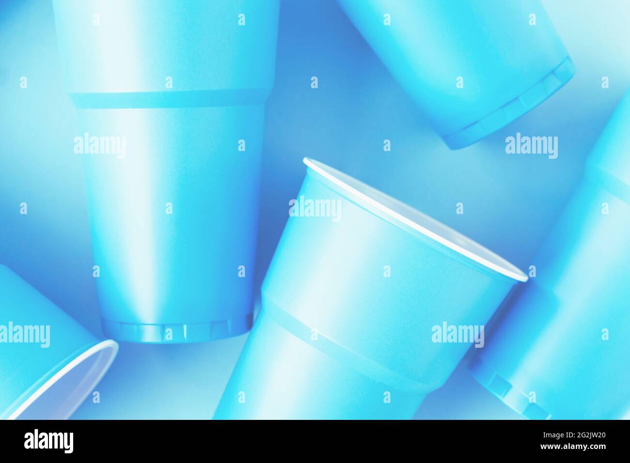 Neon blue plastic cups. Eco concept. Flatlay Stock Photo - Alamy