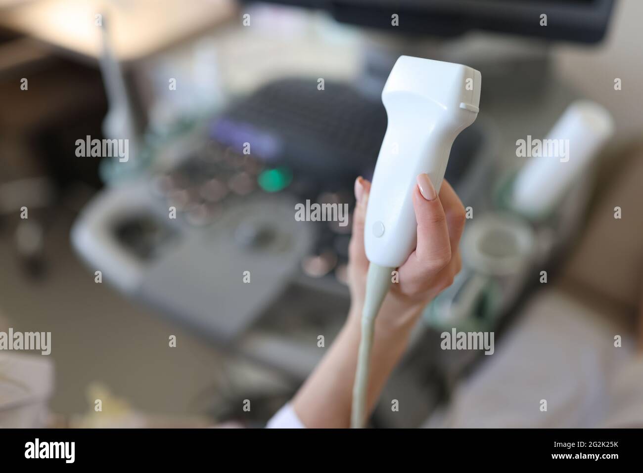 Doctor holding ultrasound probe in his hand in clinic closeup Stock ...