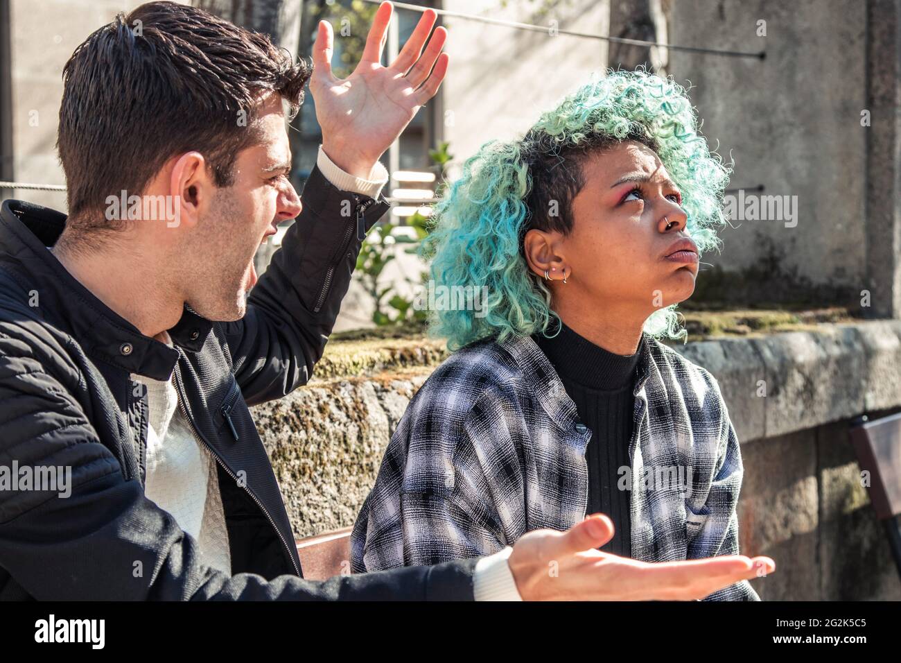couple arguing or fighting screaming in the street Stock Photo - Alamy