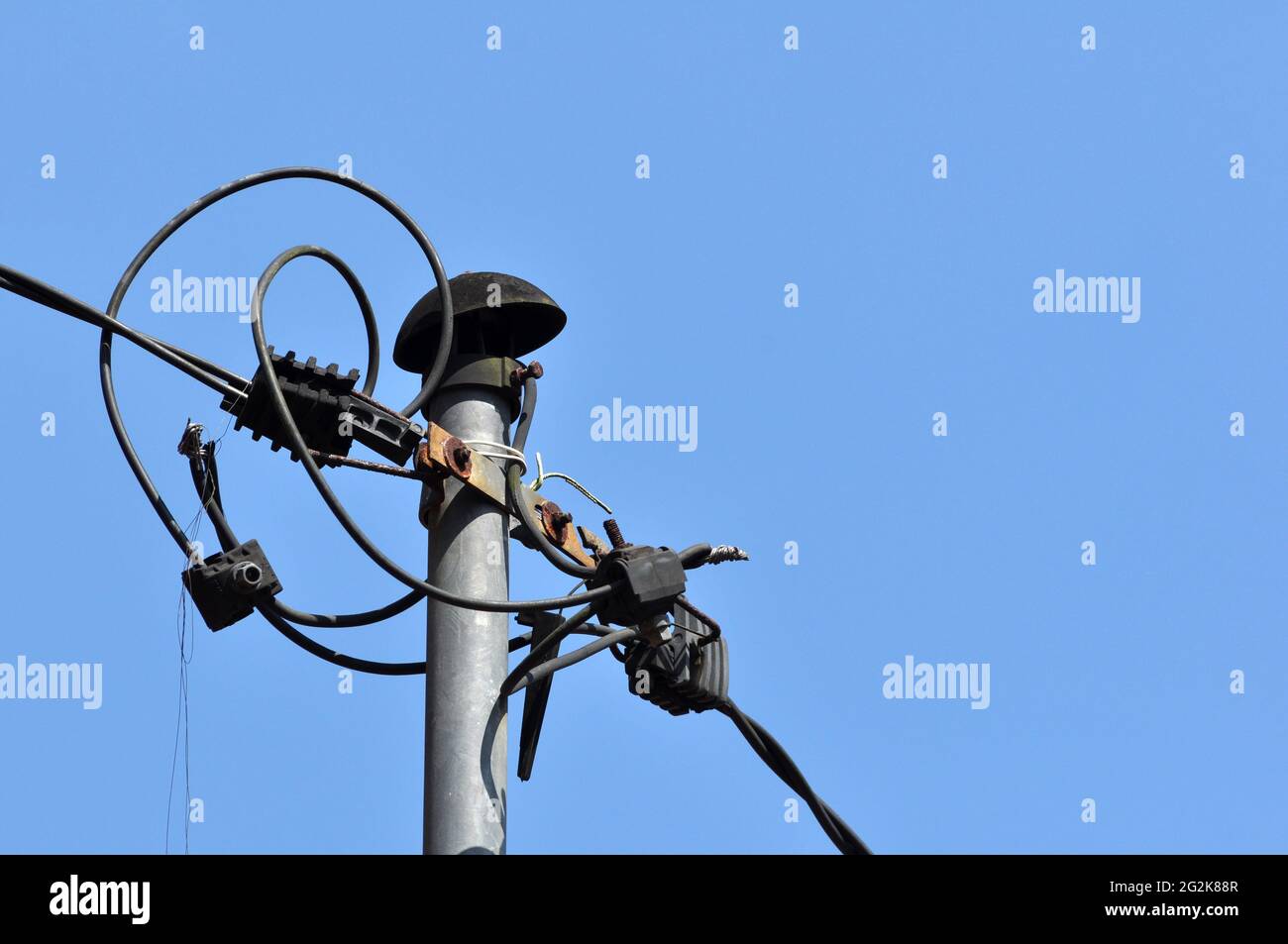 Electrical cable poles on the roof of the house Stock Photo - Alamy