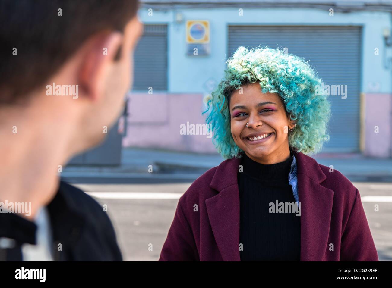 young girl smiling avoiding boy's gaze Stock Photo - Alamy