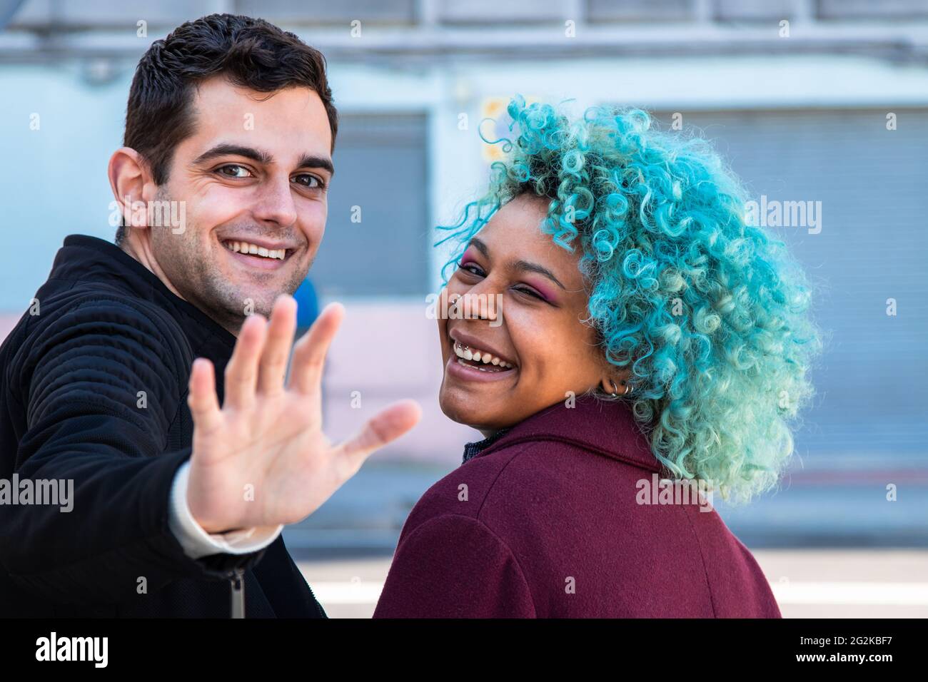 Two people waving goodbye hi-res stock photography and images - Alamy