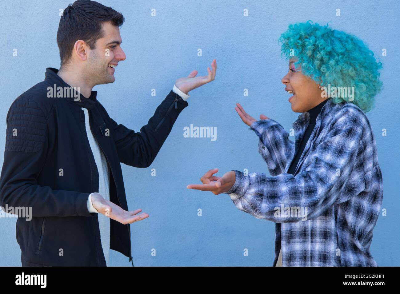 young people talking happy in the street Stock Photo - Alamy