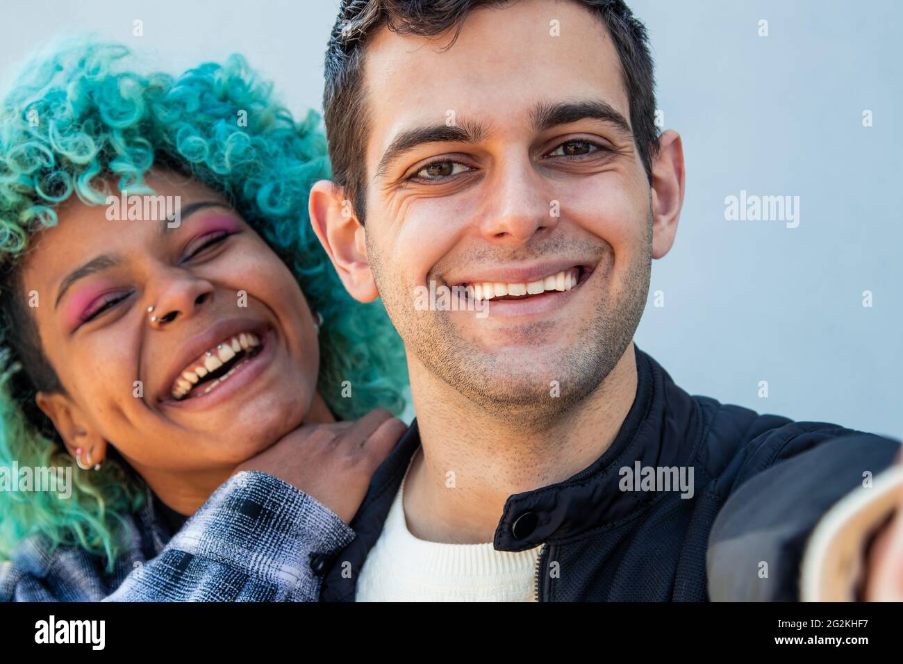 portrait of multiracial couple smiling happy Stock Photo - Alamy
