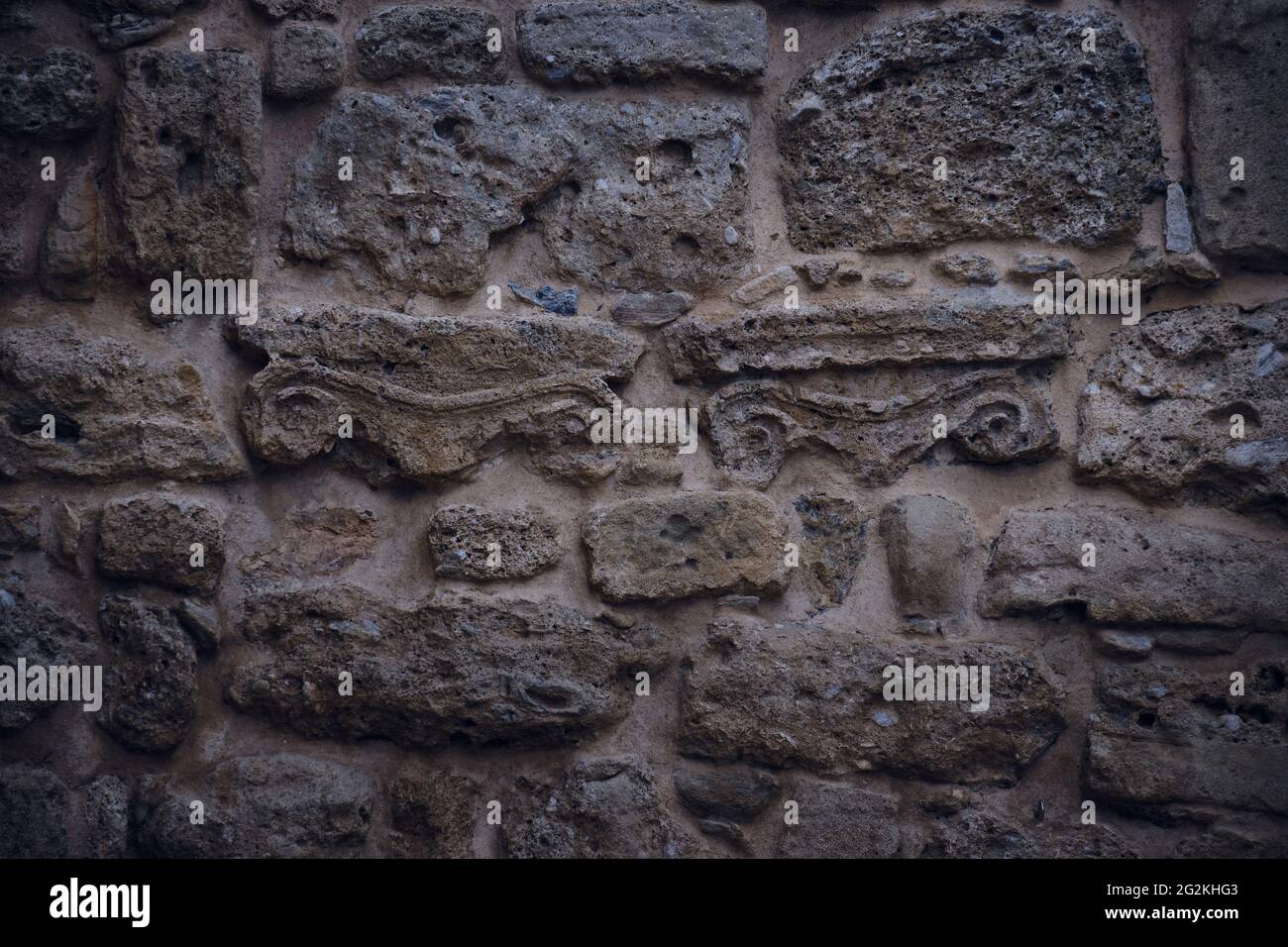 Closeup shot of engravings and symbols in an ancient stone wall Stock ...