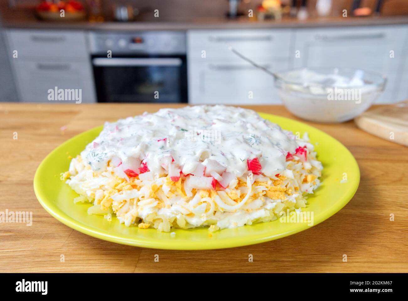 The process of making a delicious salad of crab sticks, carrots, smoked ...