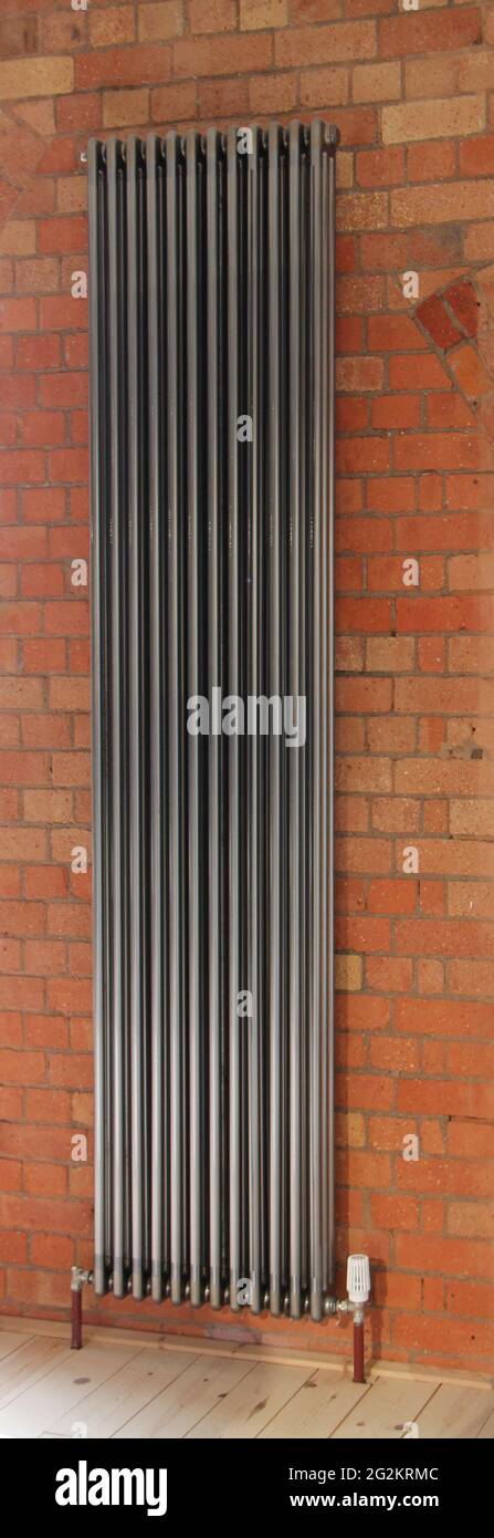 A Tall Slim Metal Central Heating Water Radiator Stock Photo - Alamy