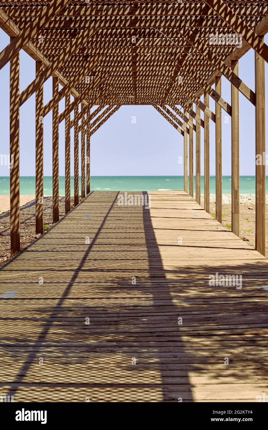 Wooden tunnel on the beach of Moncofar Costa del Azahar in the province ...