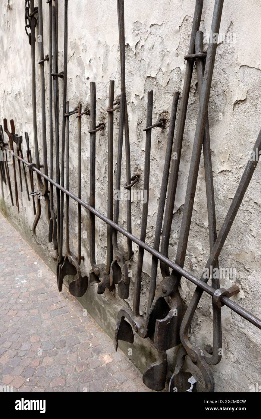 decorated facade with old agricultural tools in the small old village ...