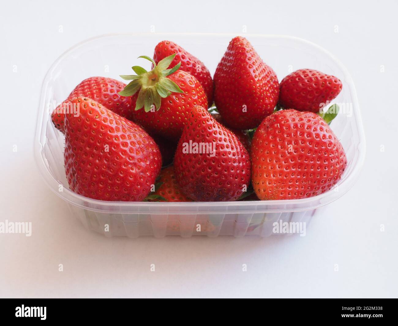 box of large strawberries over white background Stock Photo - Alamy