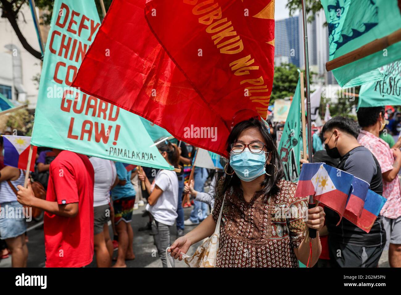 Metro Manila, Philippines. 12th June 2021. Activists carry signs and ...