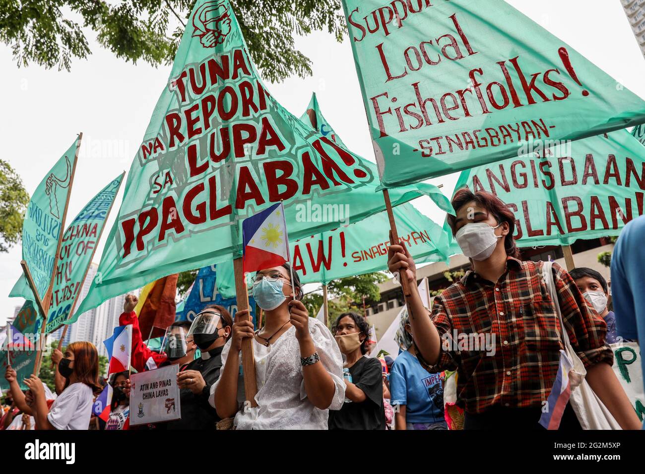 Metro Manila, Philippines. 12th June 2021. Activists shout slogans ...