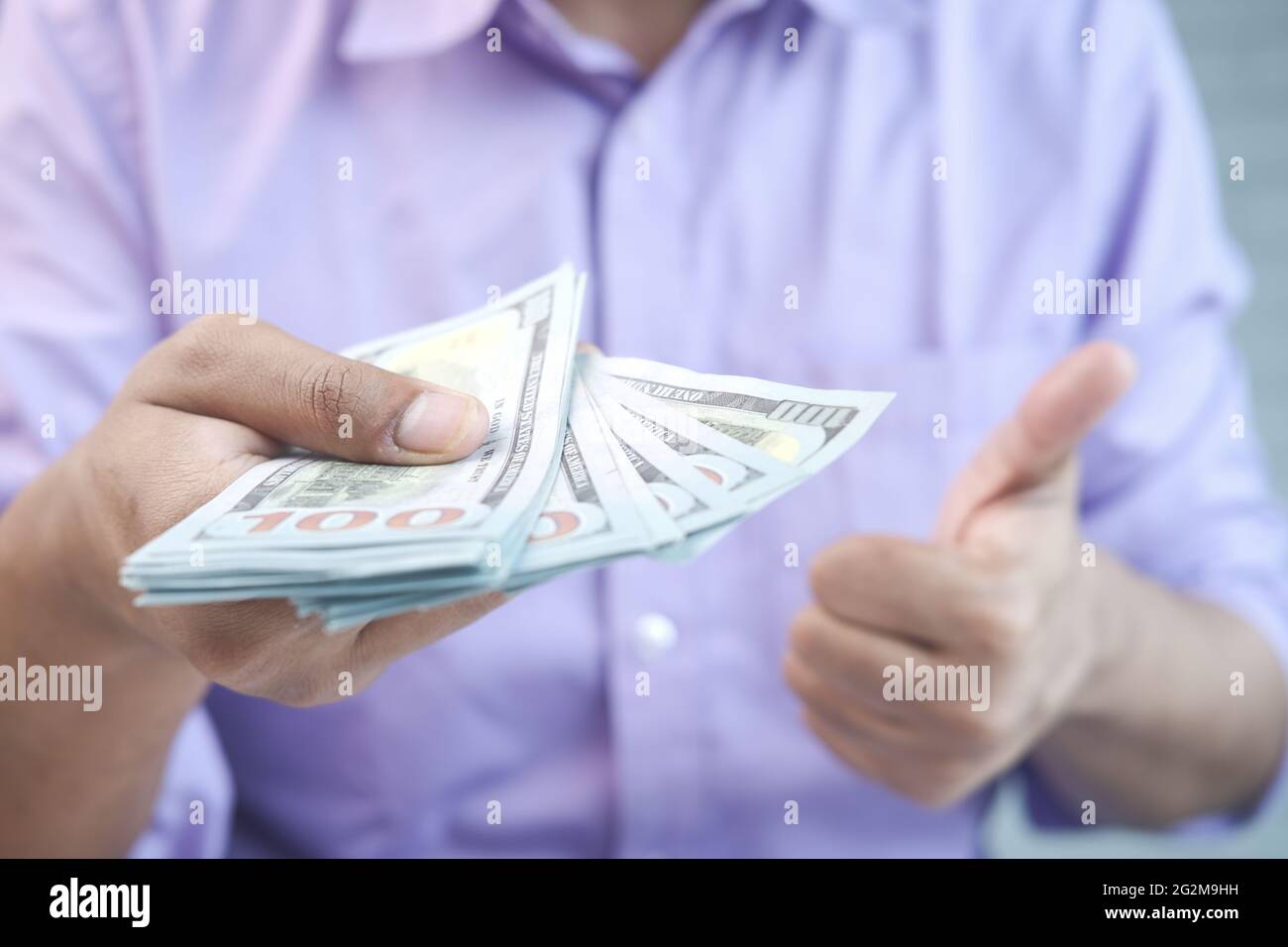 Man money showing thumbs up hi-res stock photography and images - Alamy
