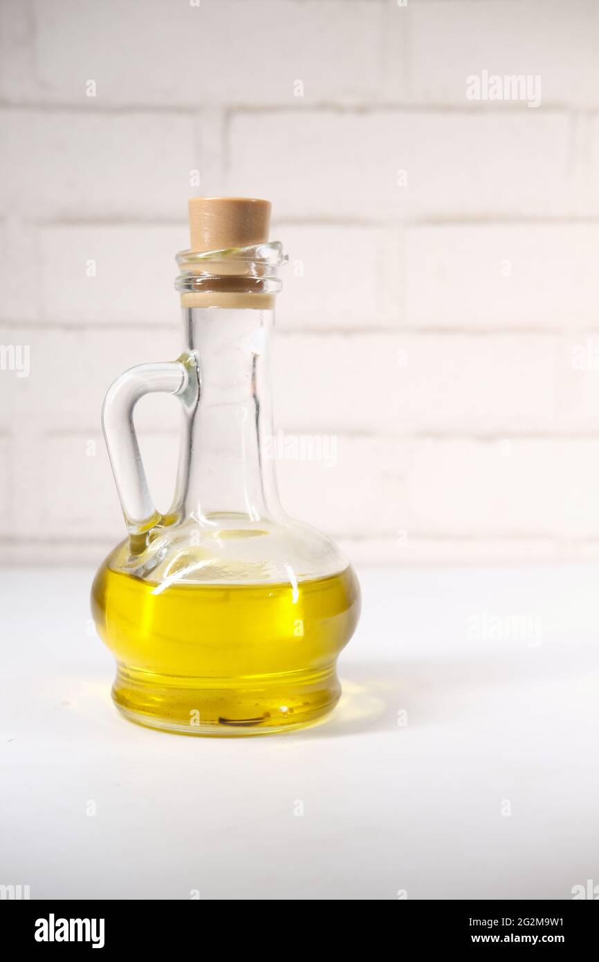 bottle of olive oil on table Stock Photo - Alamy