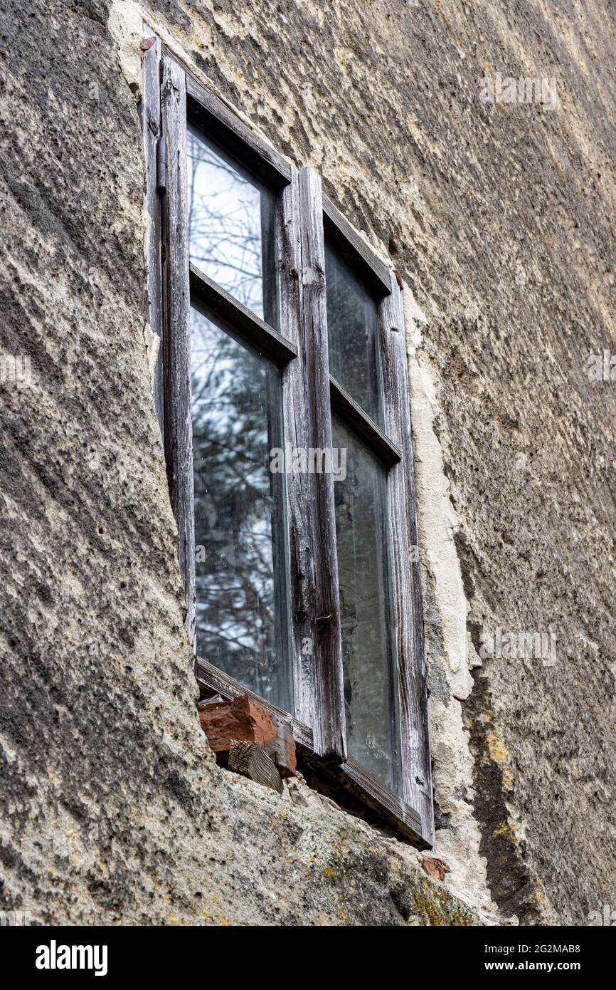 An old window in the stone facade of a historic house, known as the ...