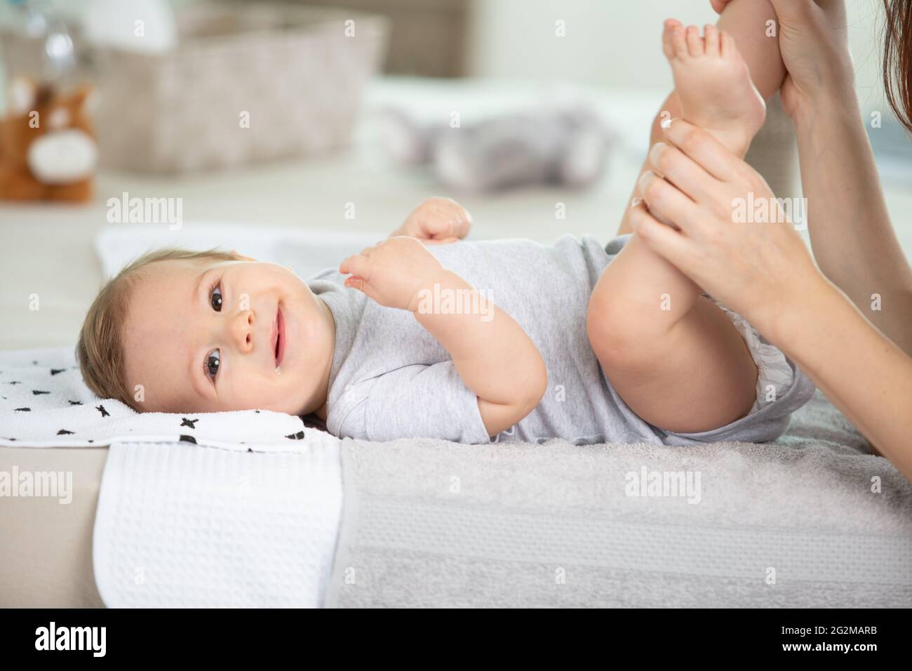 Changing diapers of hi-res stock photography and images - Alamy