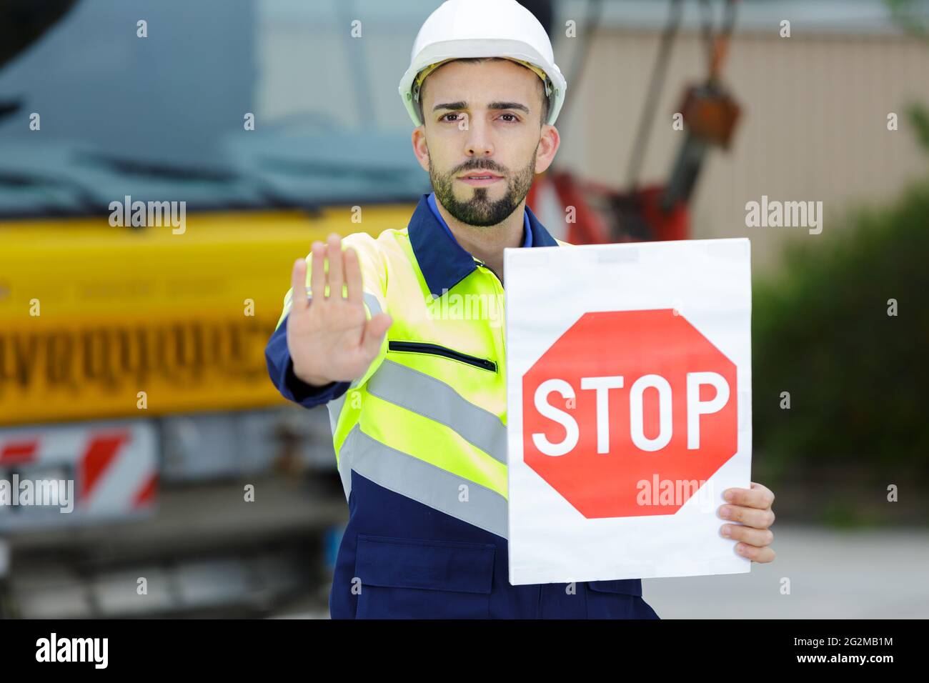Workman holding stop sign High Resolution Stock Photography and Images ...