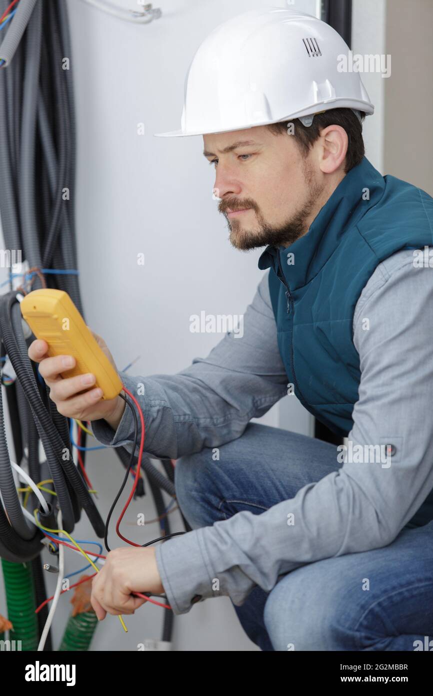 electrical student checks phase rottation for high voltage cable Stock ...