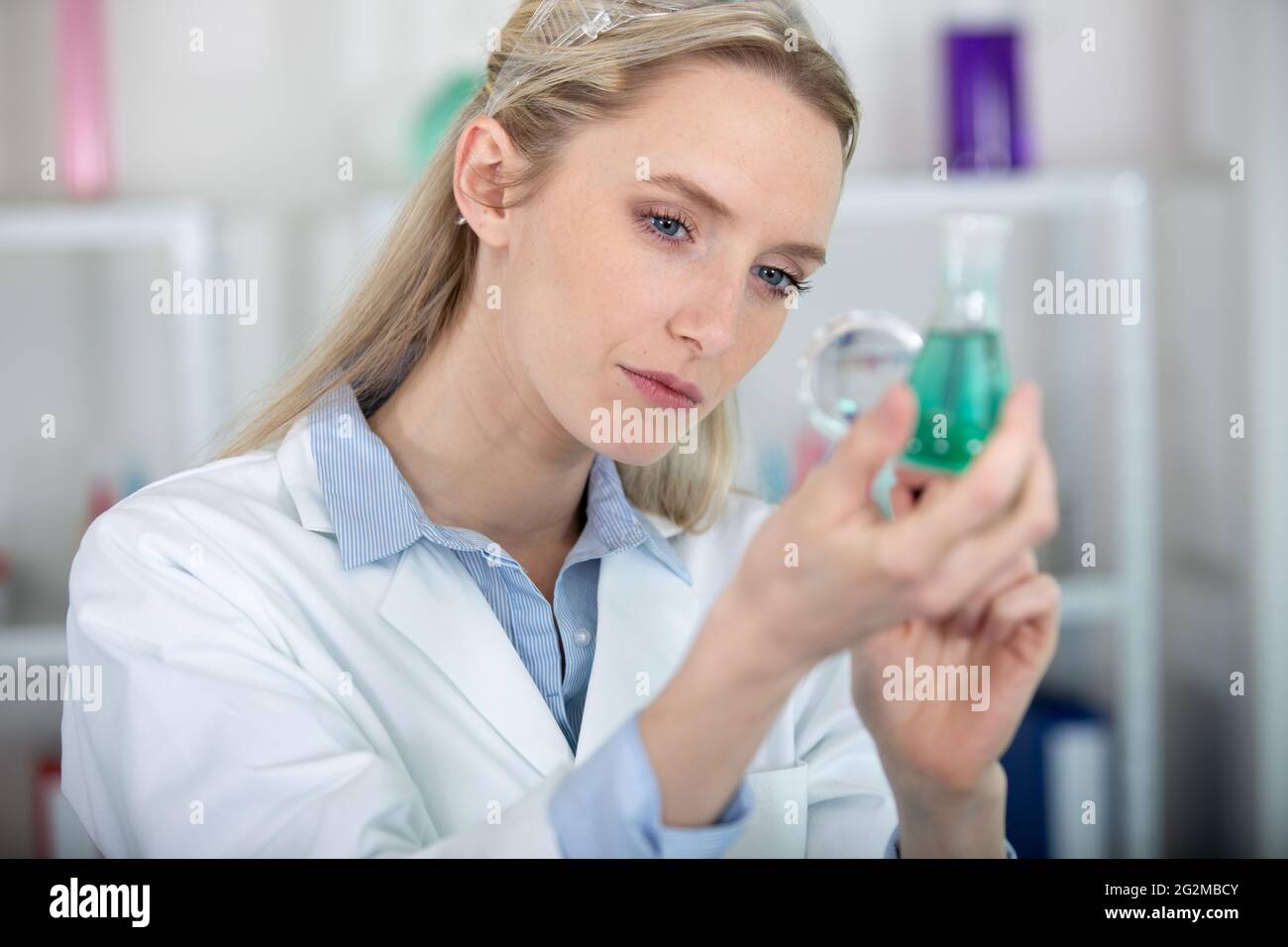 attractive young phd student scientist observing the color shift Stock ...