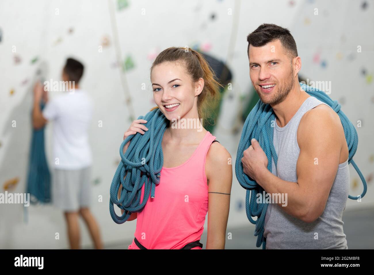 portrait of climbing couple carrying ropes Stock Photo - Alamy