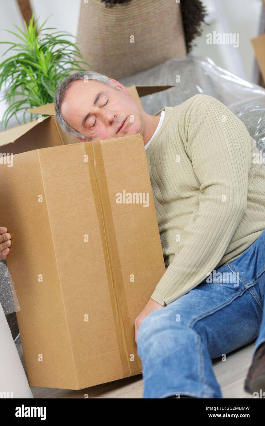 Man sleeping moving boxes hi-res stock photography and images - Alamy