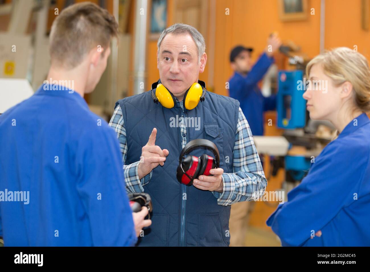 Listening to instructions hi-res stock photography and images - Alamy