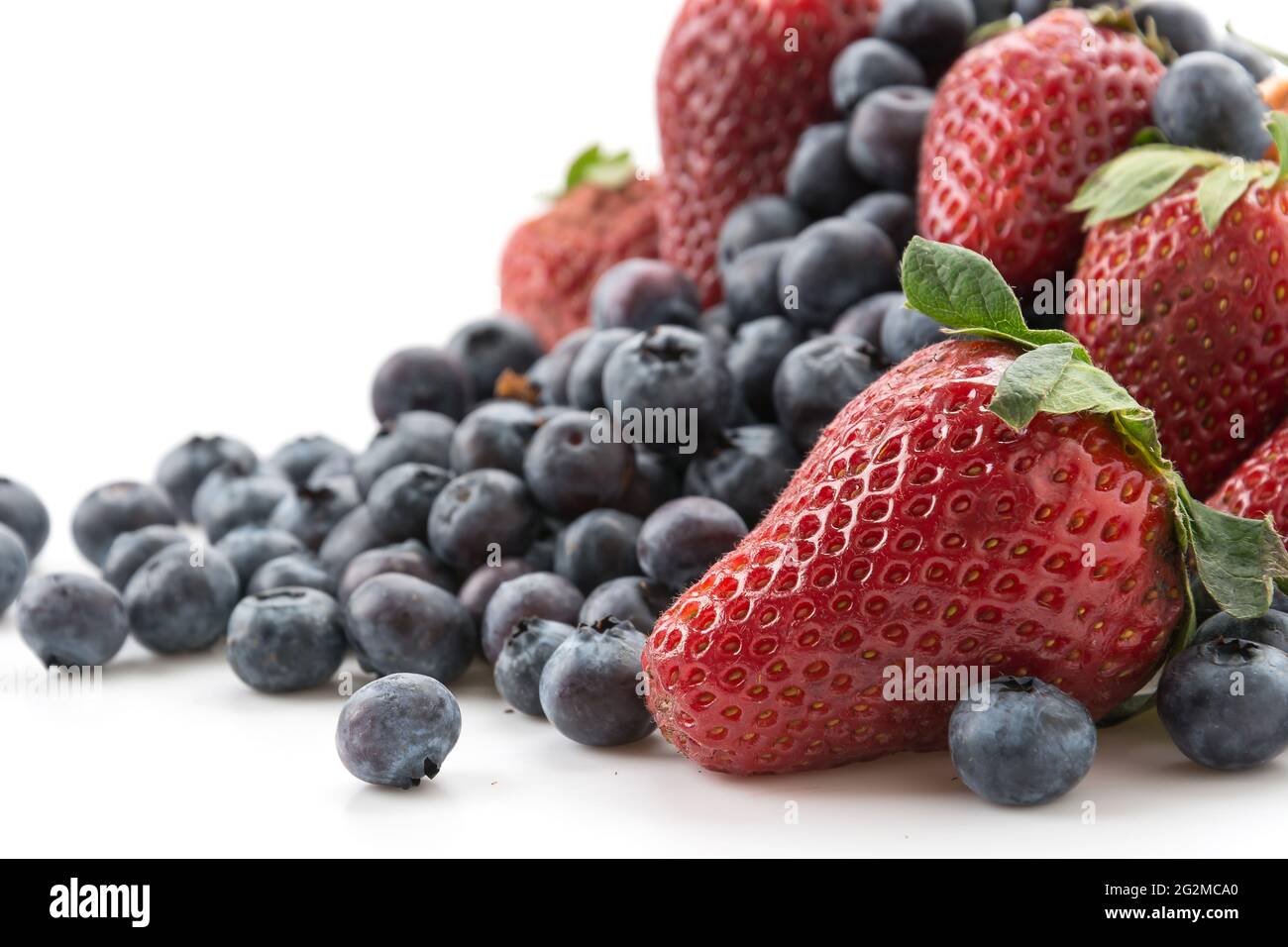 blueberry and strawberry on white background Stock Photo - Alamy