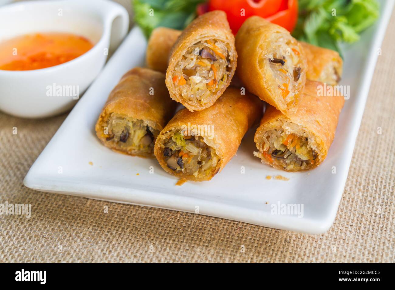 Deep fried spring rolls and sweet sauce on white plate Stock Photo - Alamy