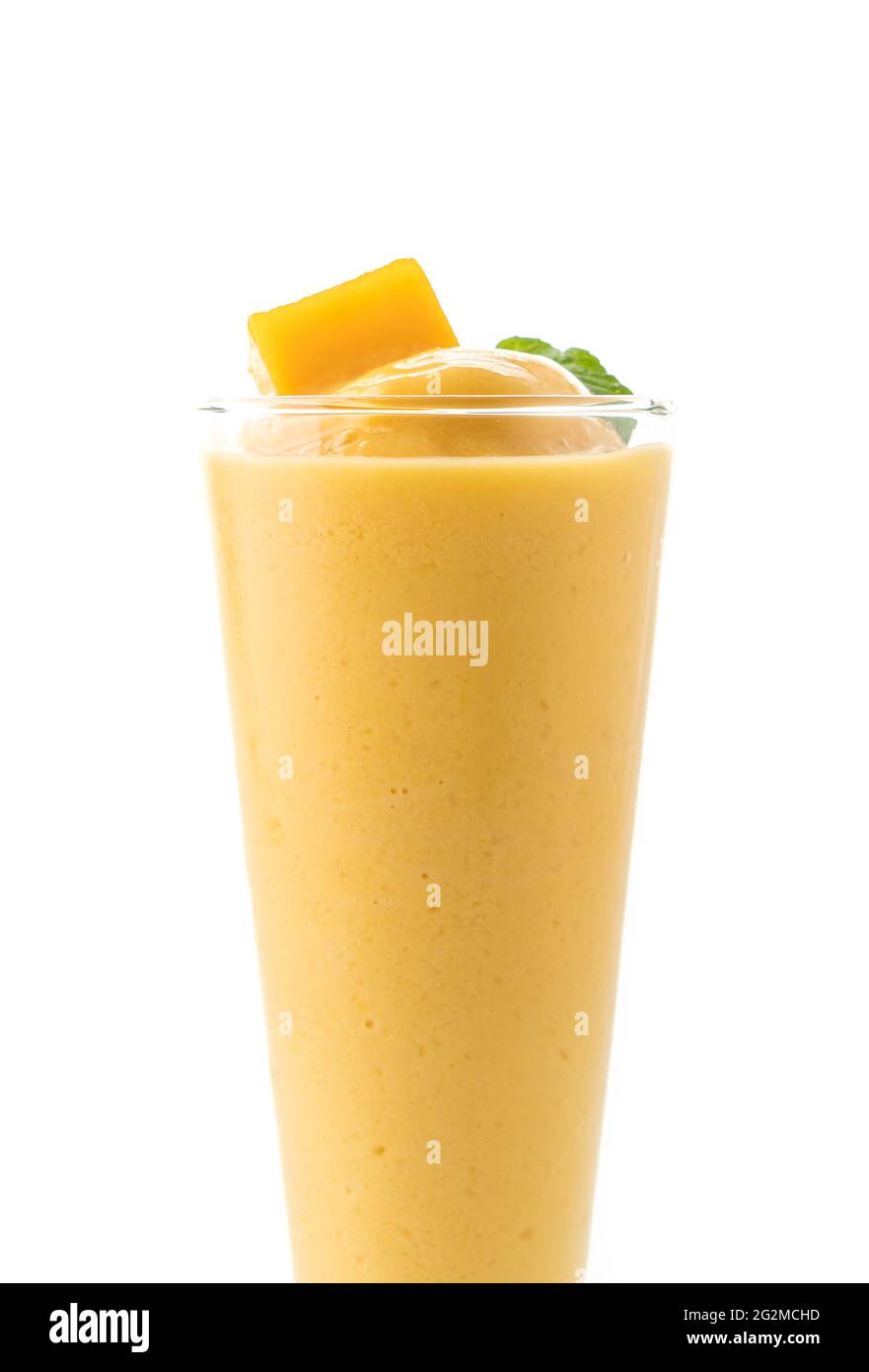 fresh mango smoothie on white background Stock Photo - Alamy