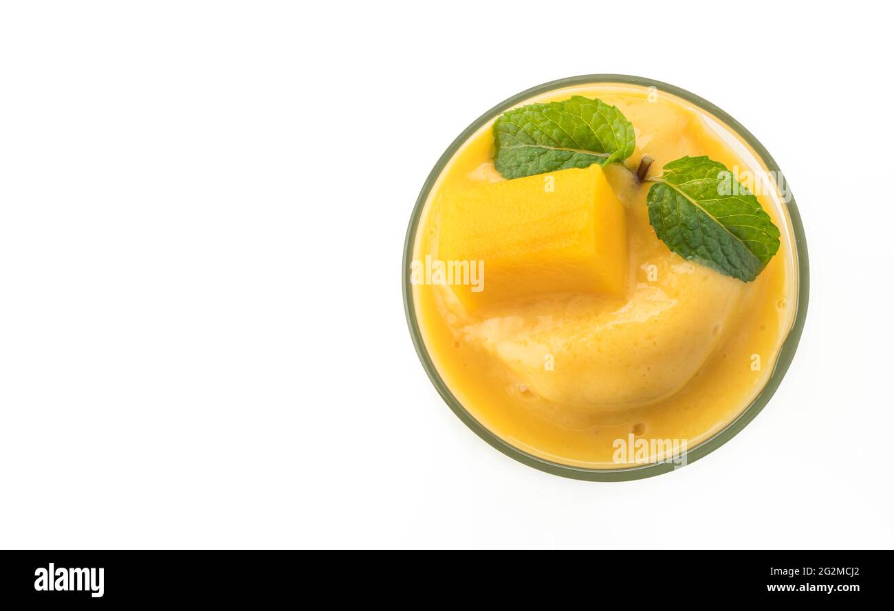 fresh mango smoothie on white background Stock Photo - Alamy