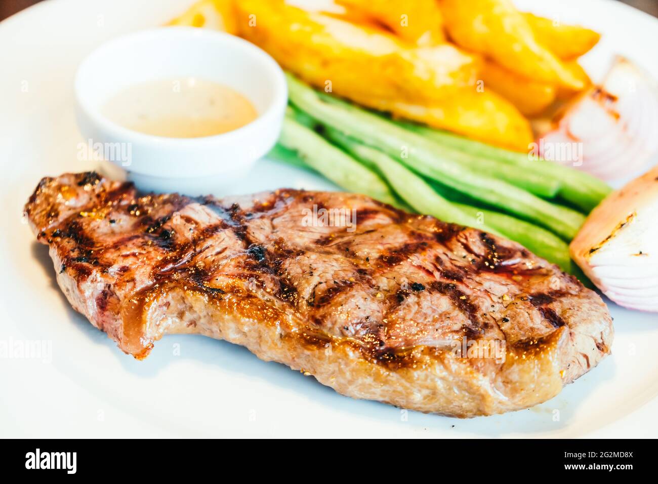 Grilled beef steak with vegetable in white plate Stock Photo - Alamy
