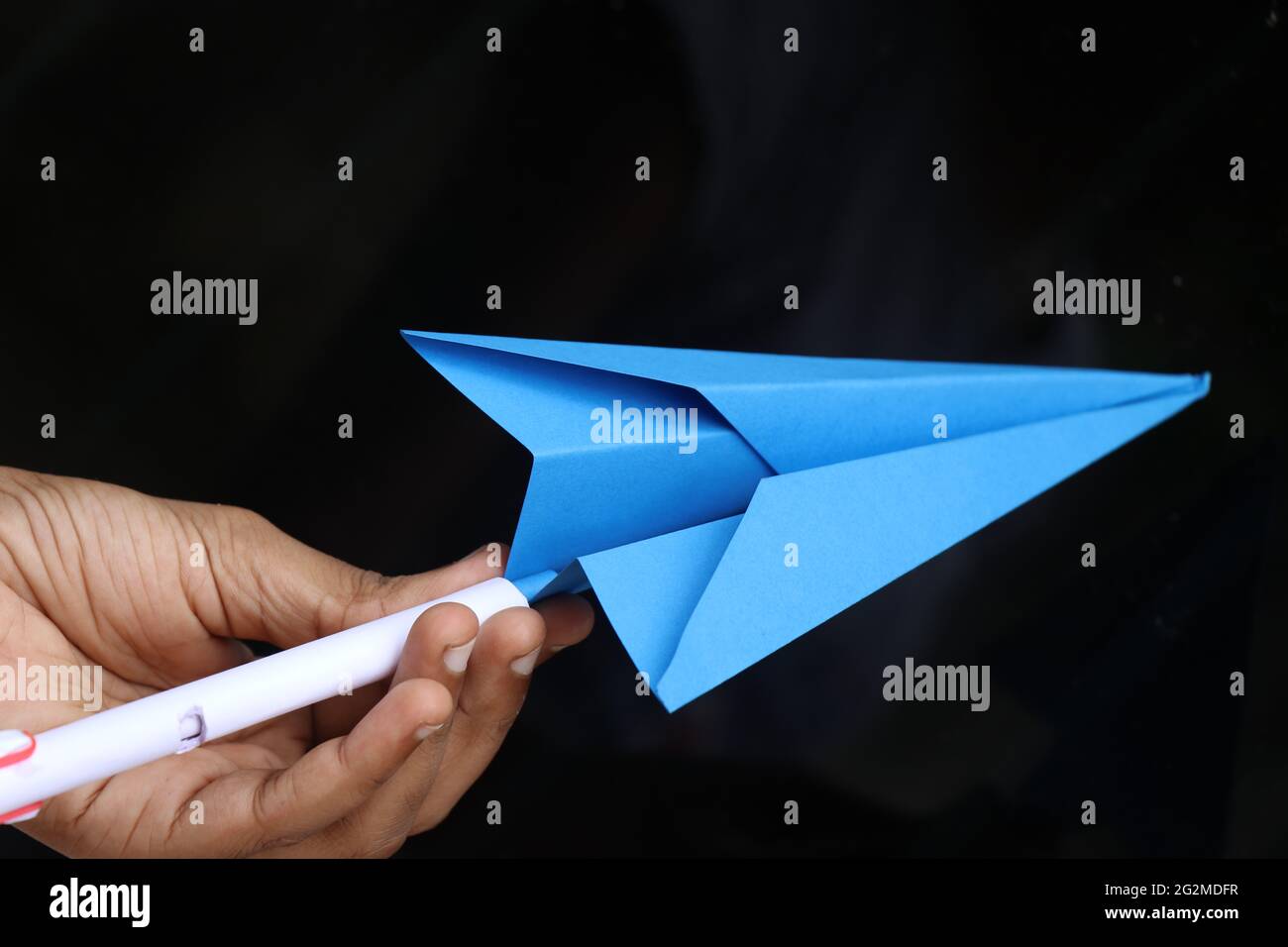 Origami paper airplane hand held. Paper crafts concept Stock Photo - Alamy