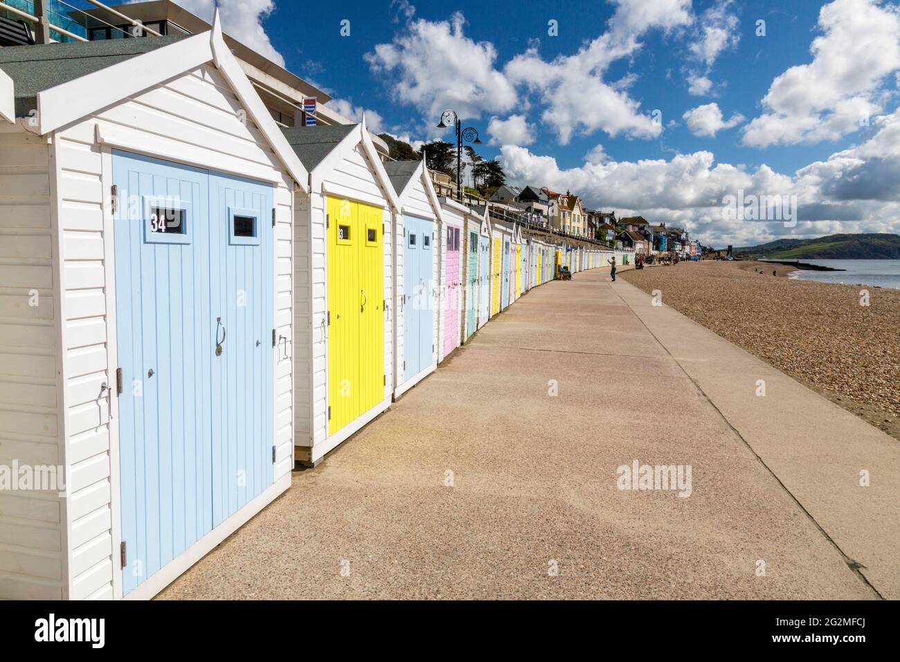 Colourful pastel coloured beach huts on the sea front in Lyme Regis on ...