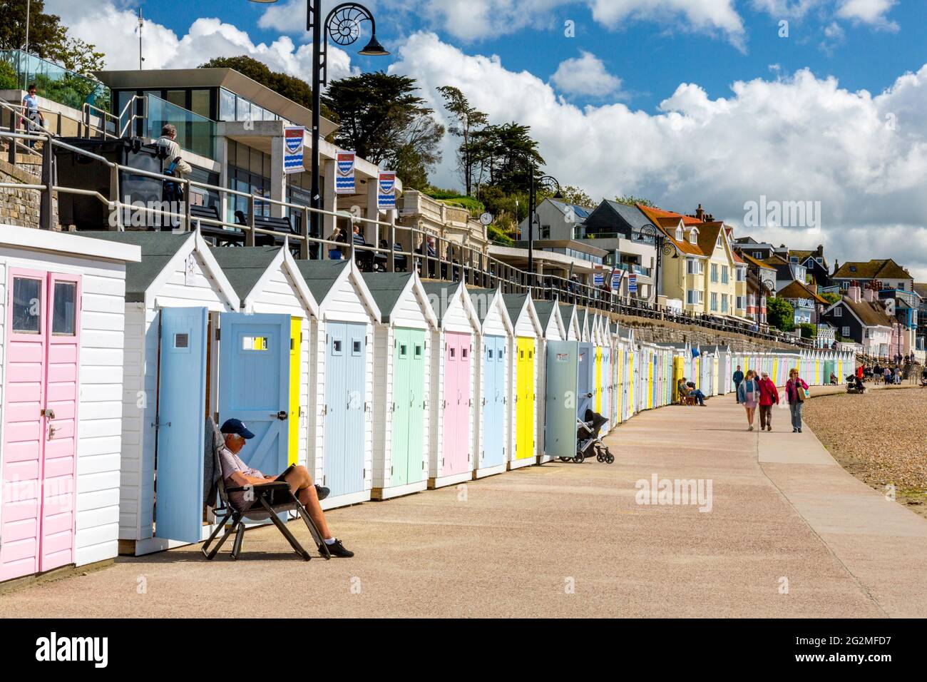 Colourful pastel coloured beach huts on the sea front in Lyme Regis on ...