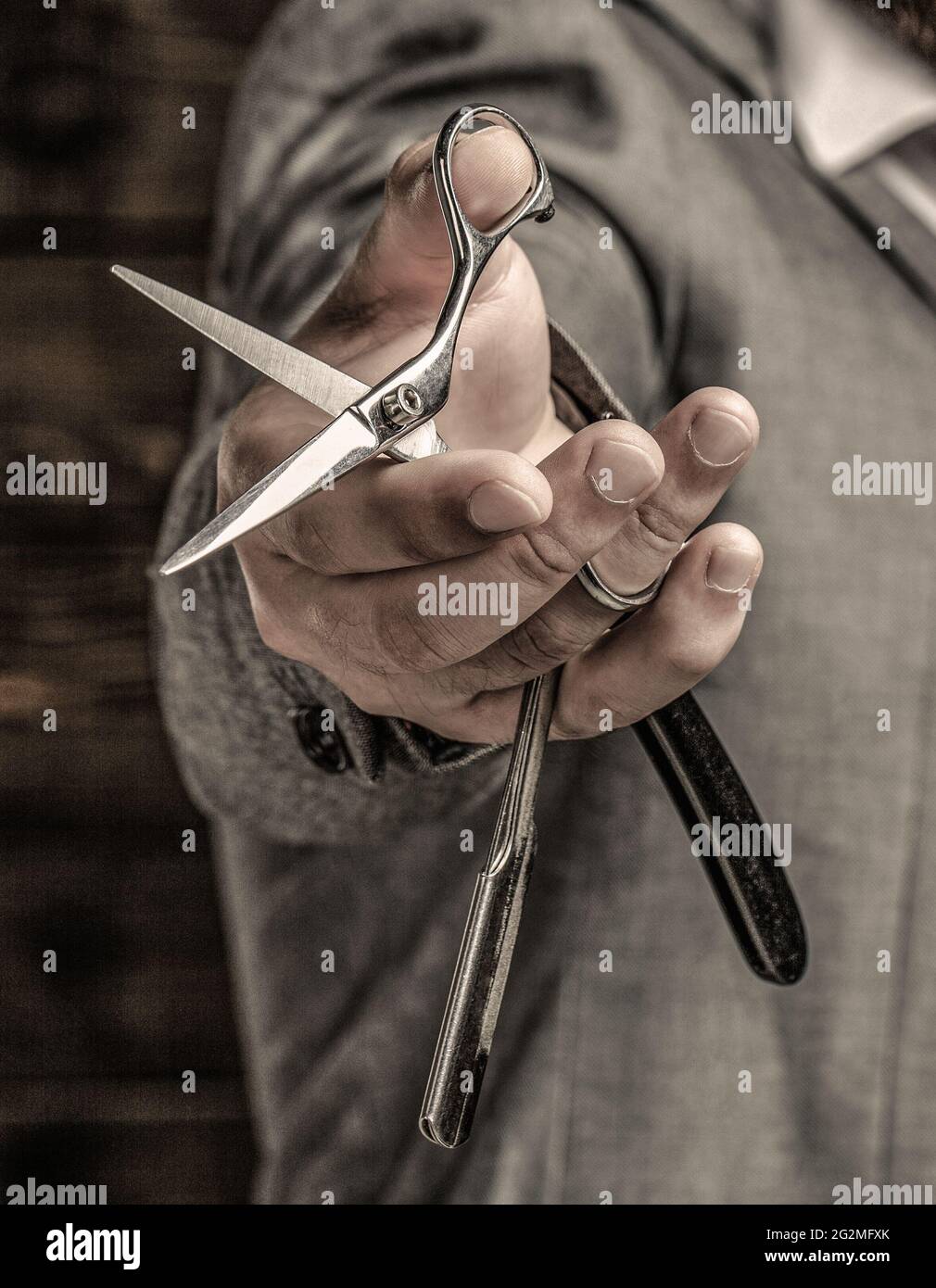 Bearded client visiting barber shop. Barber scissors and straight razor ...