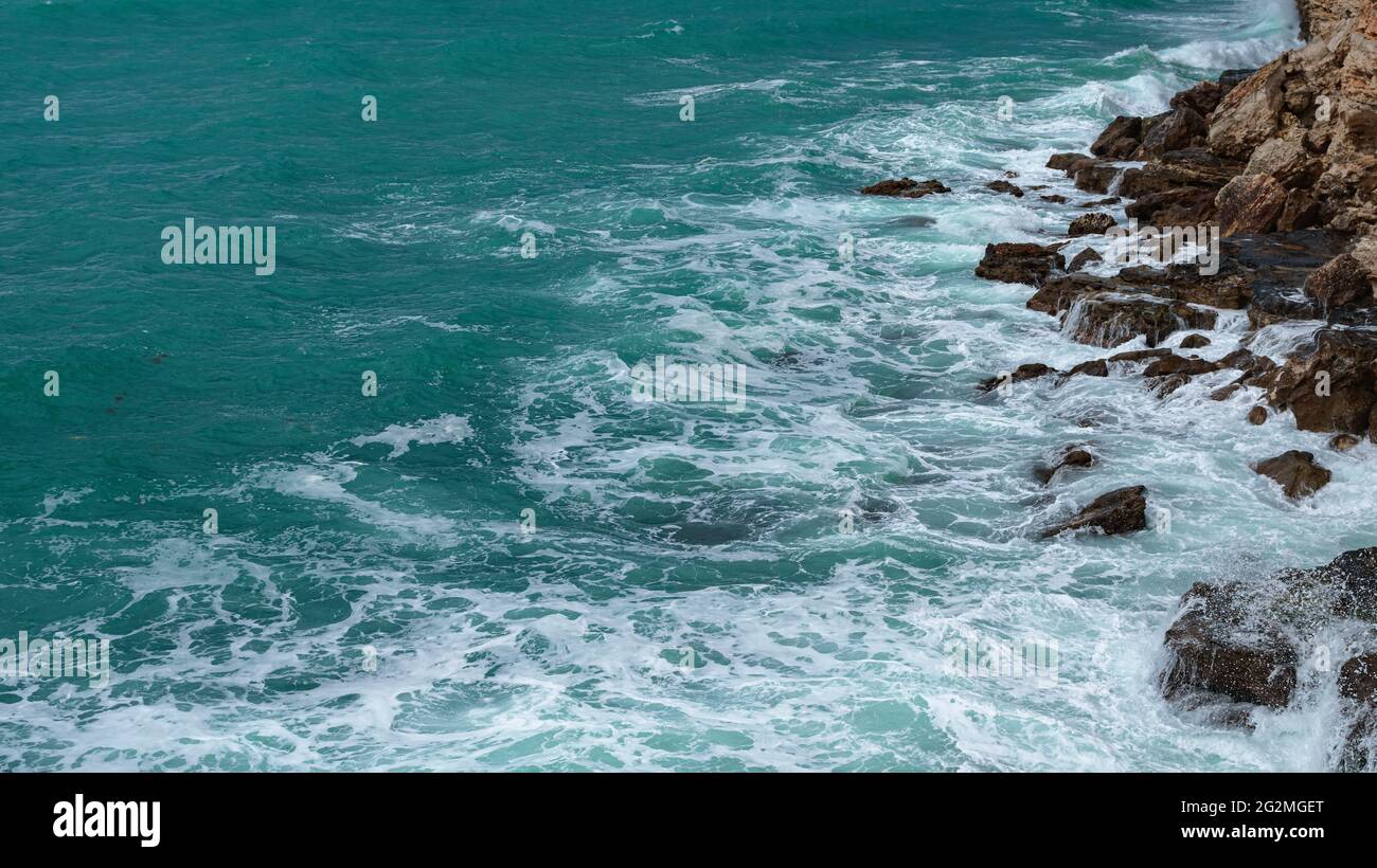 Beautiful view of ocean waves and a fantastic rocky shore, Sea patterns ...