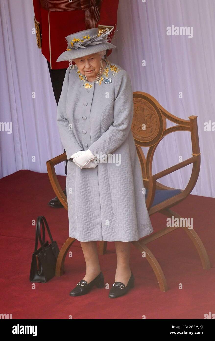 Queen Elizabeth II during a ceremony at Windsor Castle in Berkshire to ...