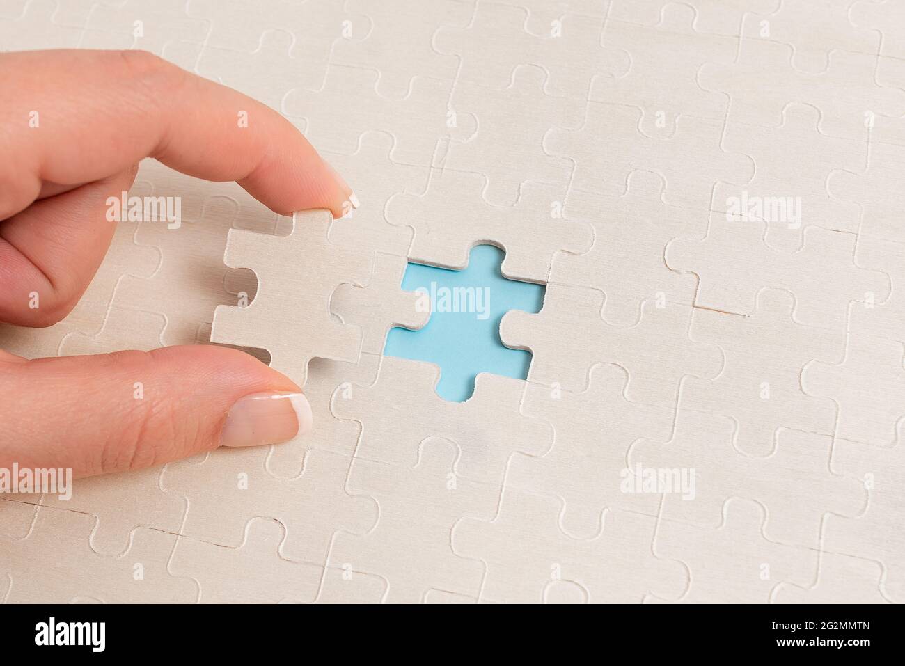 Building An Unfinished White Jigsaw Pattern Puzzle With Missing Last ...
