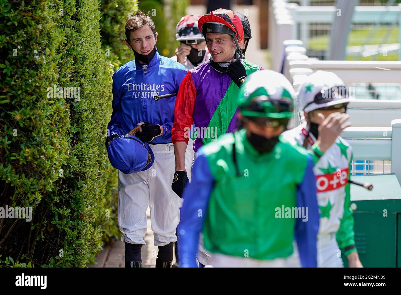 Jockey James Doyle (blue) leaves the weighing room before riding the ...