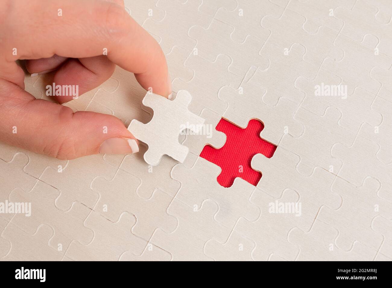 Building An Unfinished White Jigsaw Pattern Puzzle With Missing Last ...