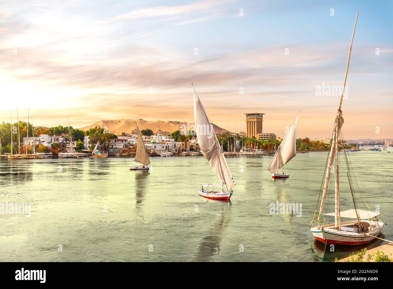Traditional Nile boats called felucca and river scenery in Aswan, Egypt ...