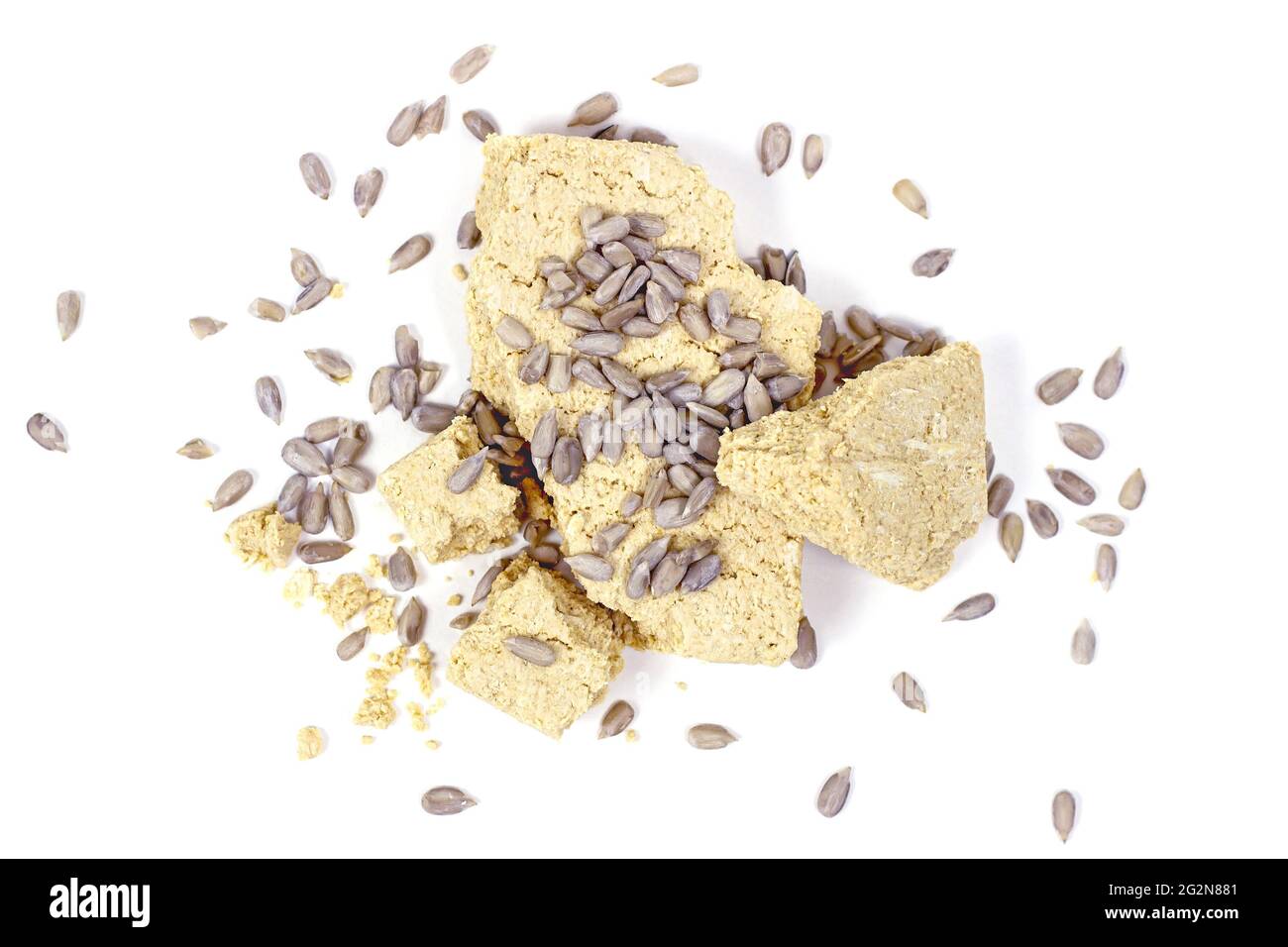 Top view of traditional sweet turkish delight halva pieces with sunflower seeds isolated on ...