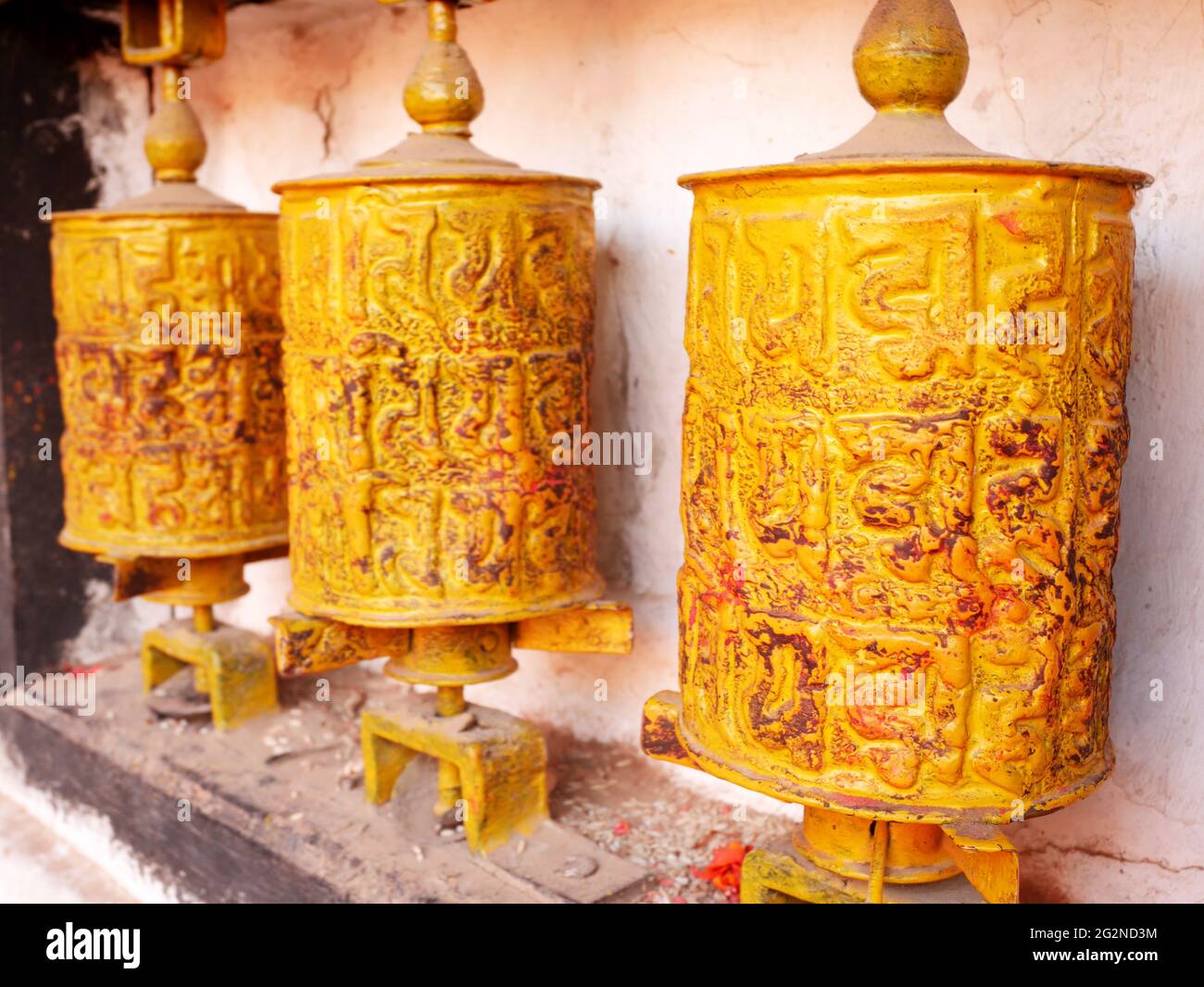Metal brass prayer wheels on wall of Hariti shrine or Ajima Hindu ...